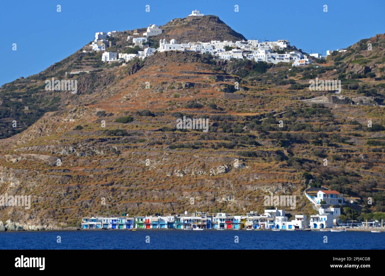 Greece, Island of Milos: the town of Tripiti, spread along the ridge ...