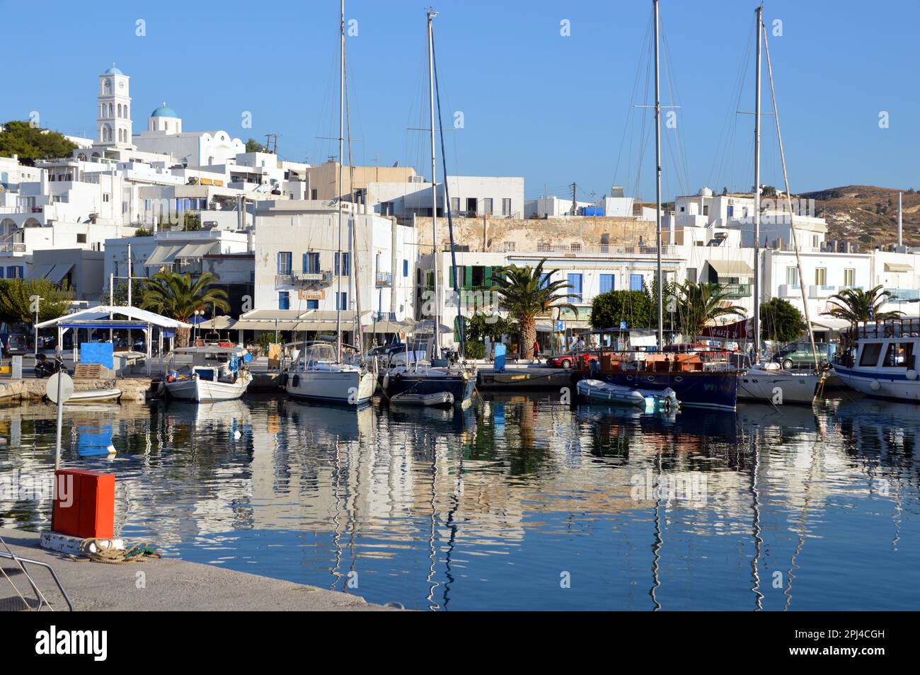 Greece, Island of Milos: the port of Adamas, reflected in the waters of ...