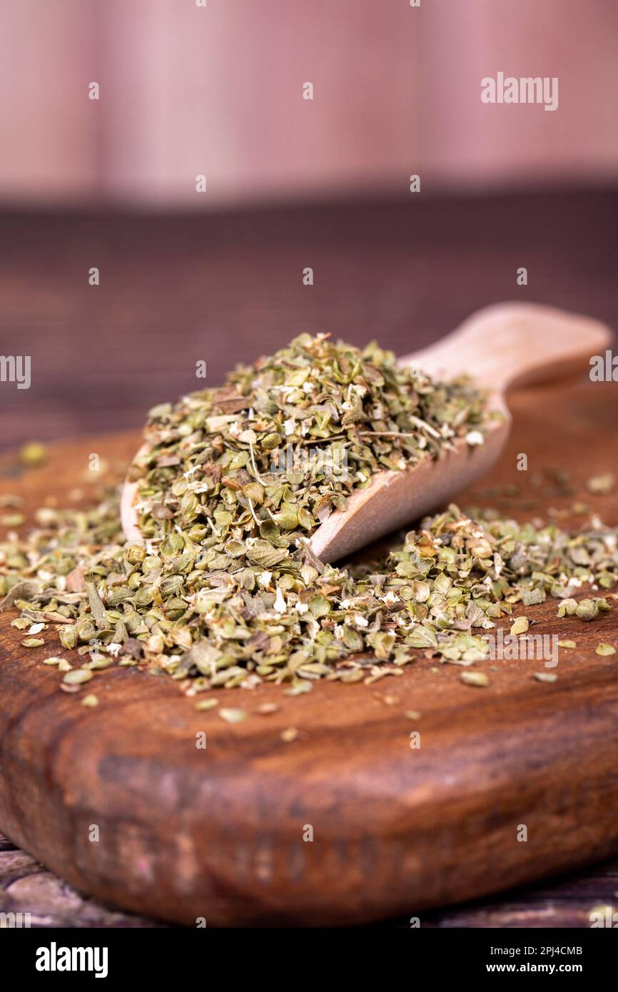 Thyme spice. Dried Thyme leaf in wooden spoon on wood background. Spice ...