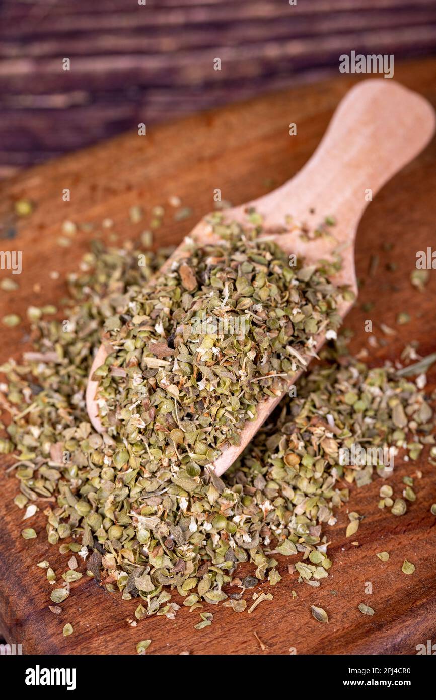 Thyme spice. Dried Thyme leaf in wooden spoon on wood background. Spice ...