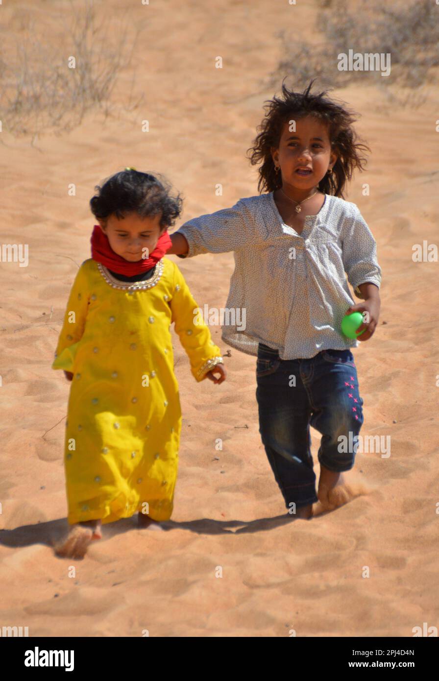 Oman: youngsters at a Bedouin camp in the Wahabi Sands, south of Al ...