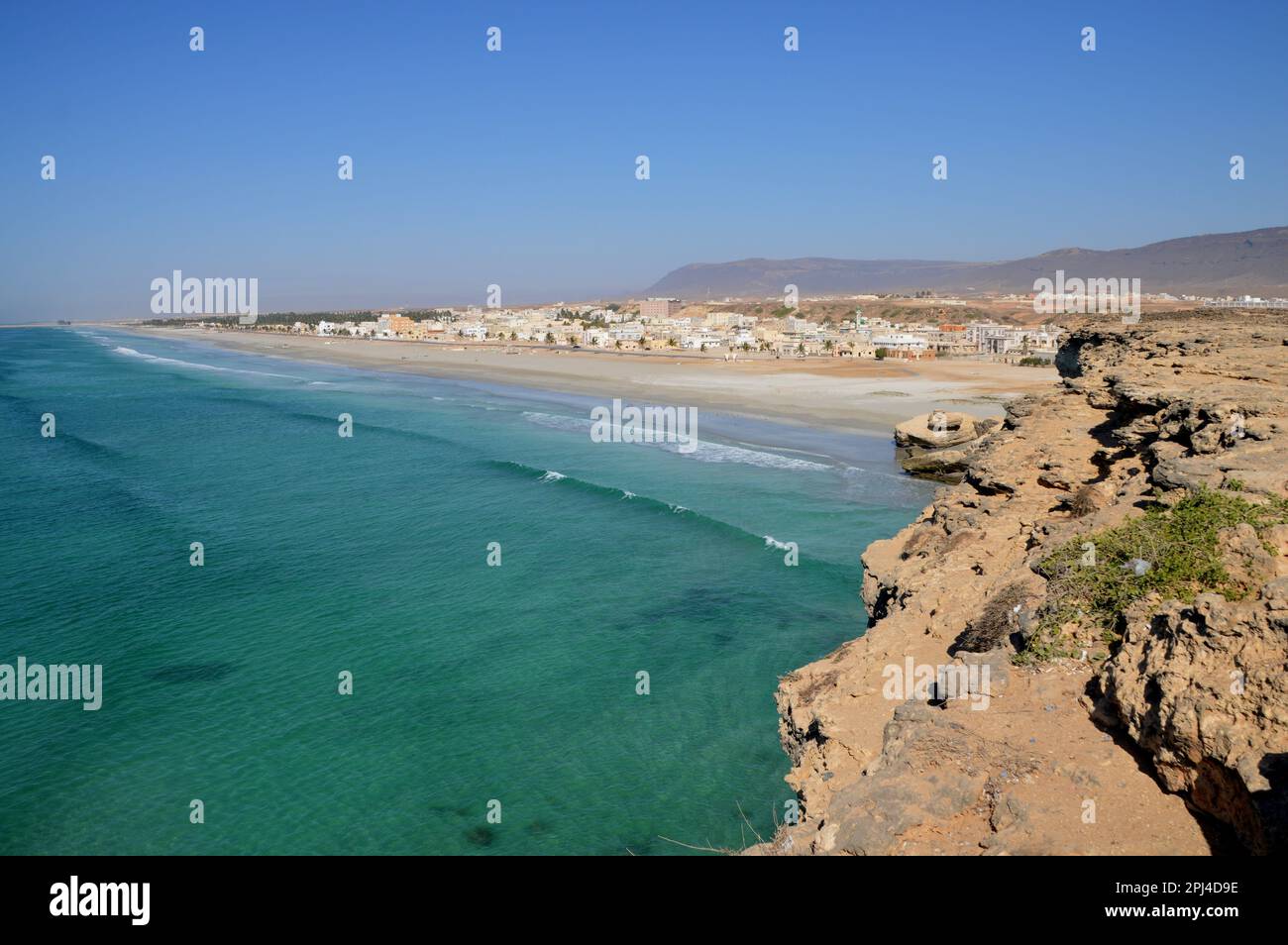 Oman, Taqah: view of the town and its beach from a look-out point on ...