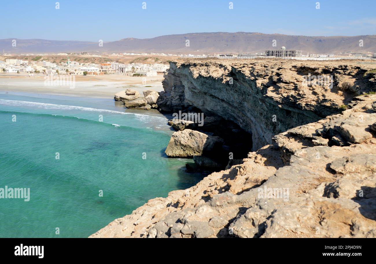 Oman, Taqah: view of the town and its beach from a rocky promontory ...