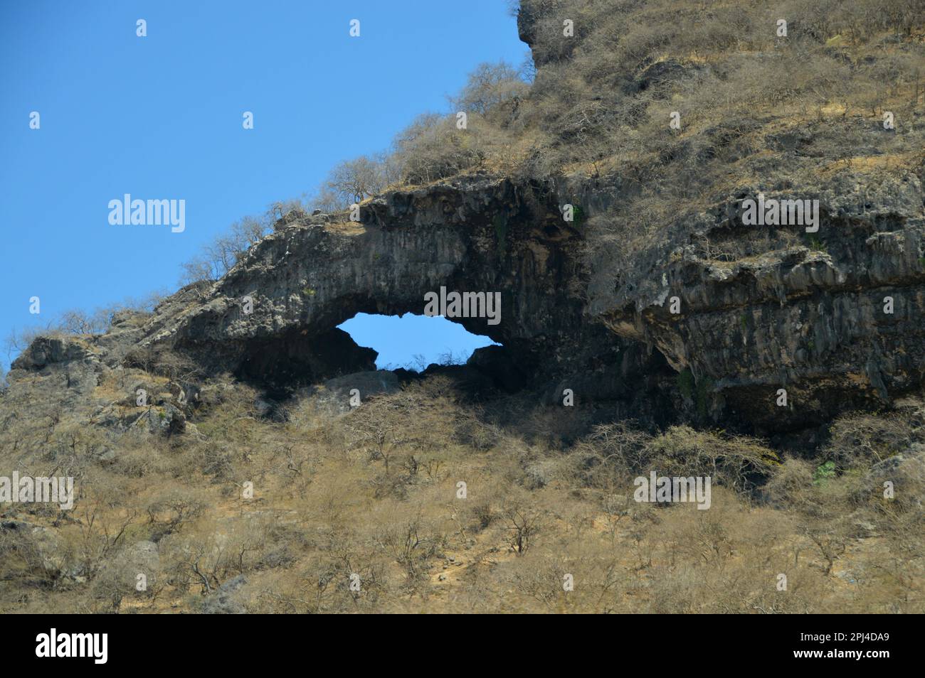 Oman, Wadi Darbat: a natural bridge in the limestone cliffs Stock Photo ...