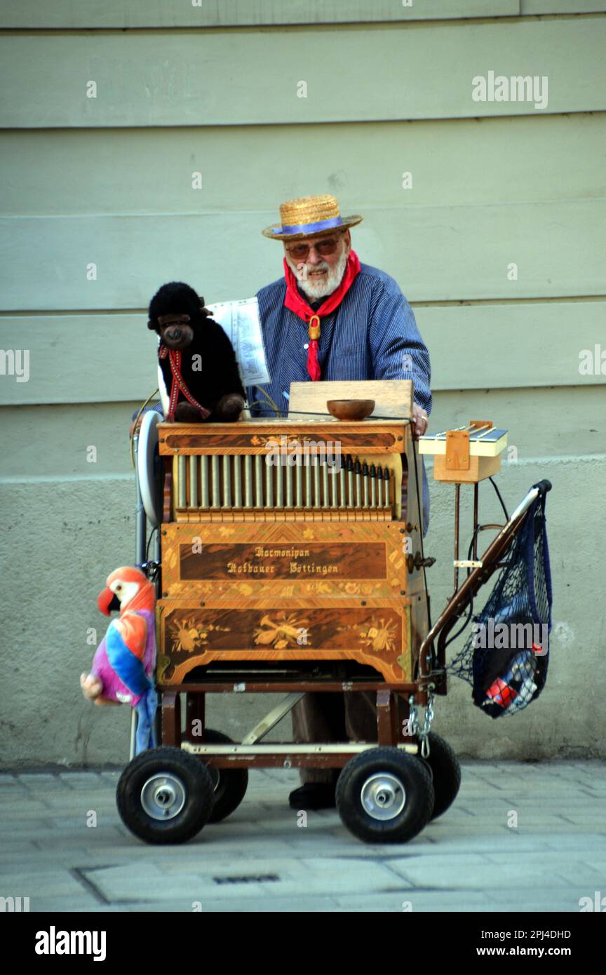 The barrel organ player hi-res stock photography and images - Alamy