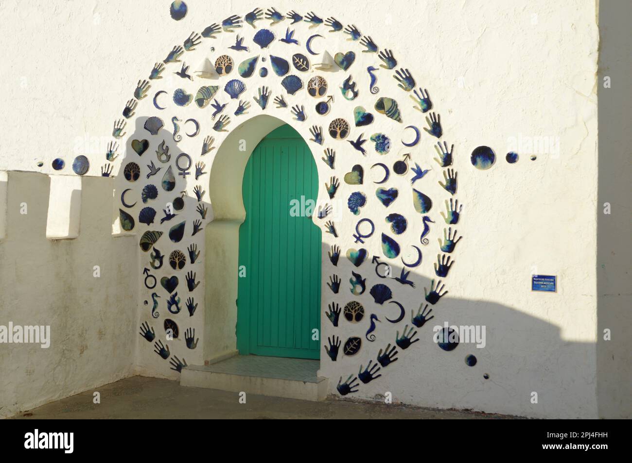 Morocco, Asilah: an artistically enhanced doorway is one of the ...