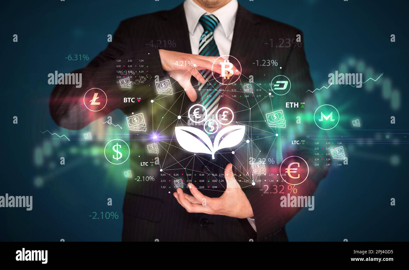 Businessman holding currency symbols concept Stock Photo - Alamy