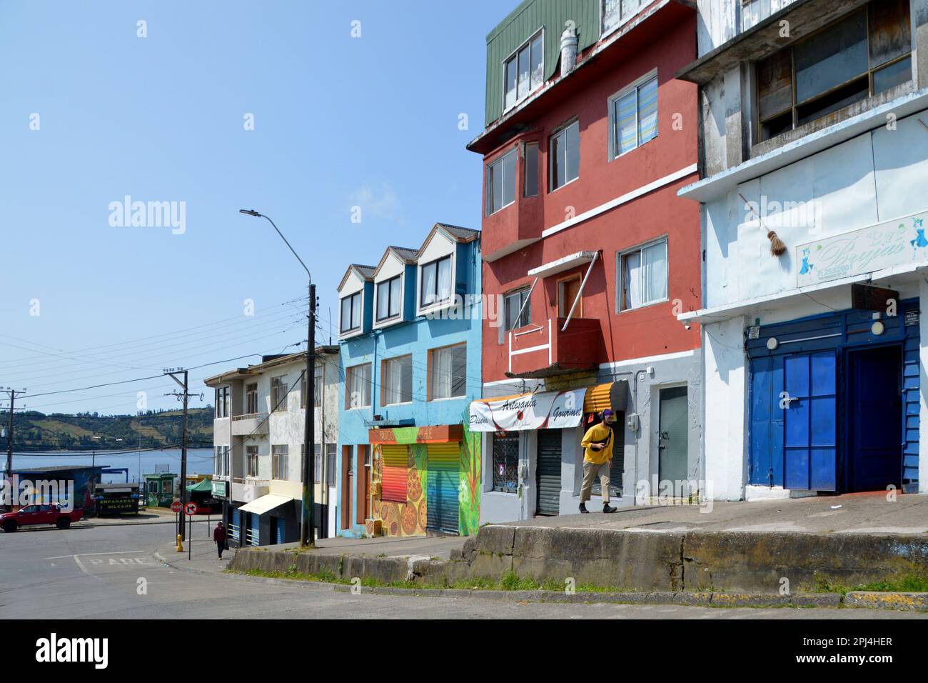 Chile. Chiloe, Castro: colourful houses line the steep hill leading to ...