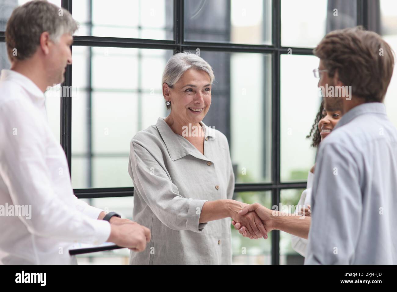 Conversation between managers and employees in the office Stock Photo ...