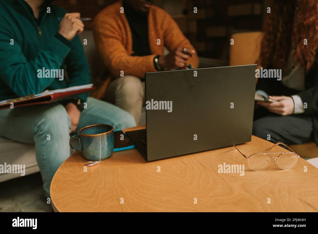 A close up photo of three multiracial business colleagues working ...