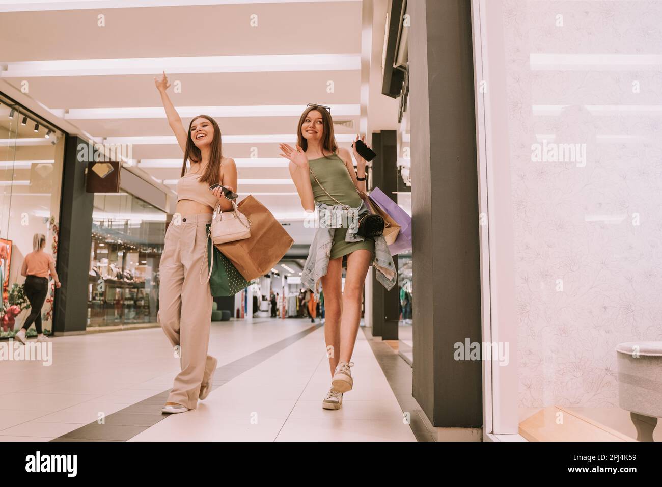 Two best friends having fun at the shopping mall Stock Photo - Alamy