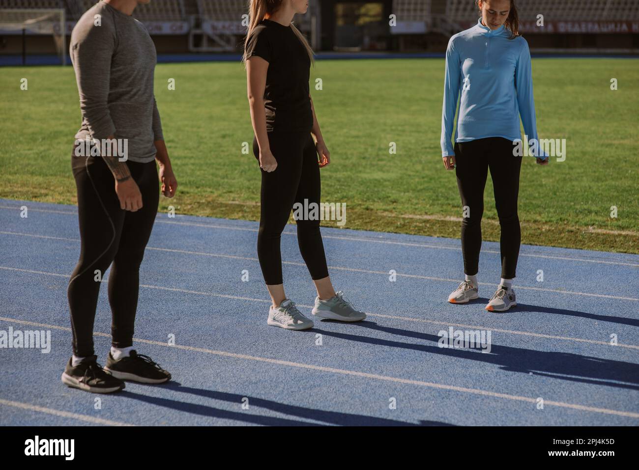 Three friends warming up together hi-res stock photography and images ...