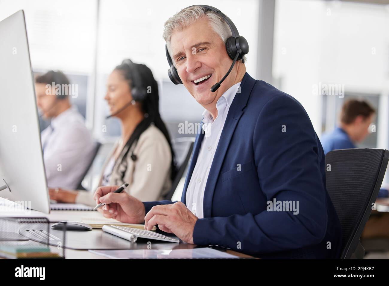 Portrait, laughing and man in call center in office working on customer ...