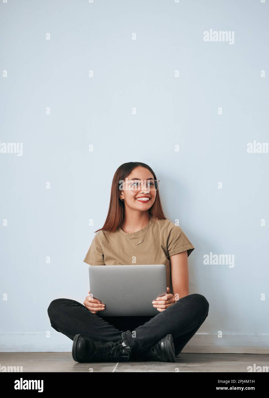 Laptop, student woman and smile by a wall with computer work for ...