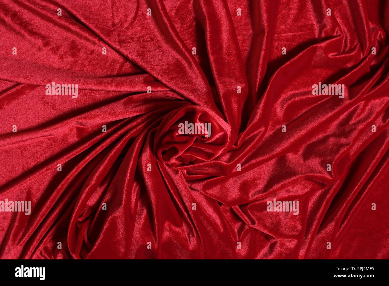 Bundle of Bright Red Velvet Fabric Overhead View Stock Photo - Alamy