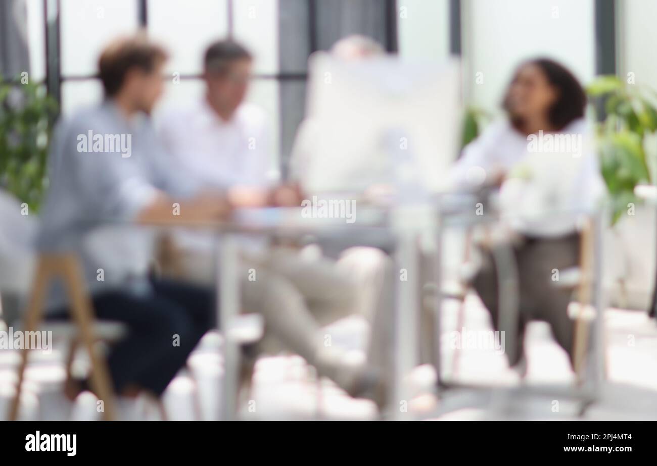 Conversation between managers and employees in the office. Blurred ...