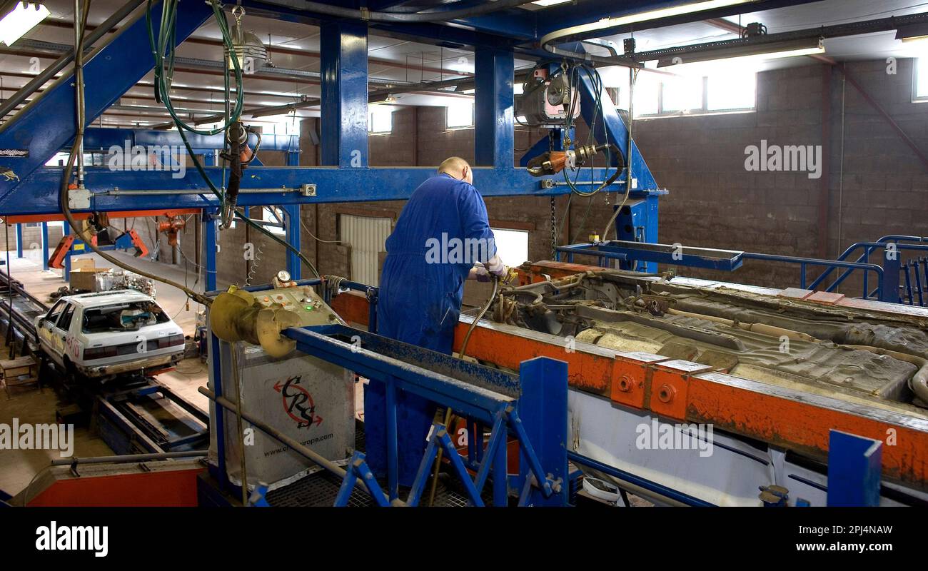 Car crusher on a scrapyard to recycle cars - Netherlands. vvbvanbree ...