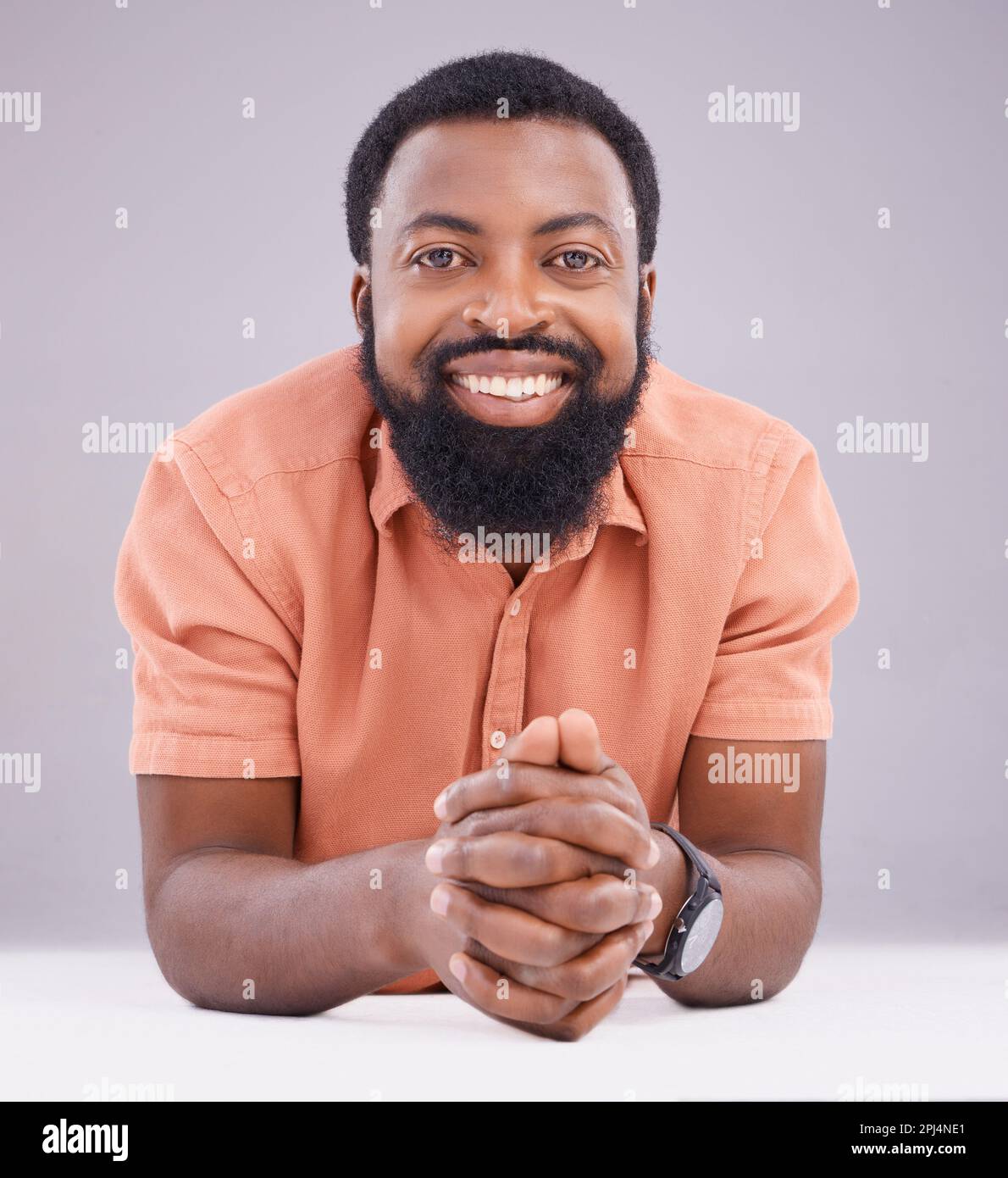 Happy, corporate and portrait of a black man by a table isolated on a ...