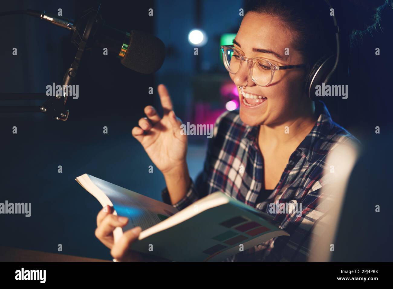 Radio dj, presenter and woman in a sound production studio reading a ...