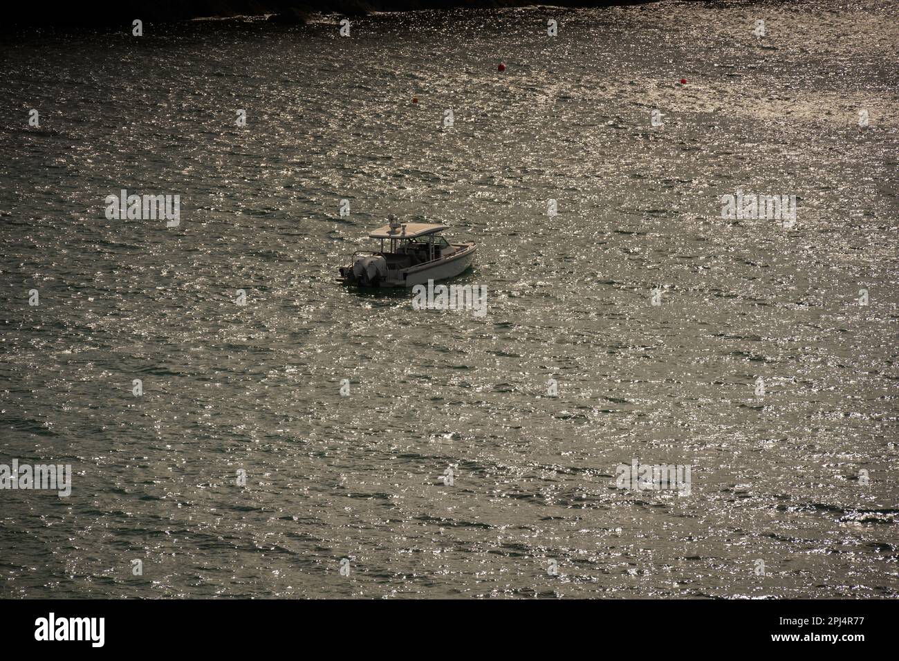 Lone boat float at the sea Stock Photo - Alamy