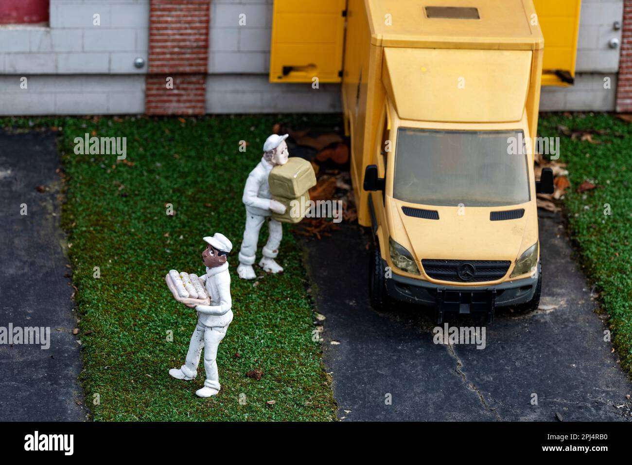 Delivery men scene model village Great Yarmouth Norfolk Stock Photo - Alamy