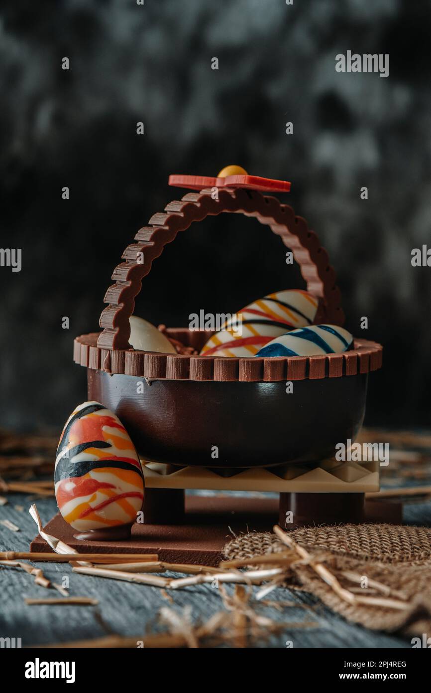 a chocolate basket with some eggs as a spanish mona de pascua, a ...