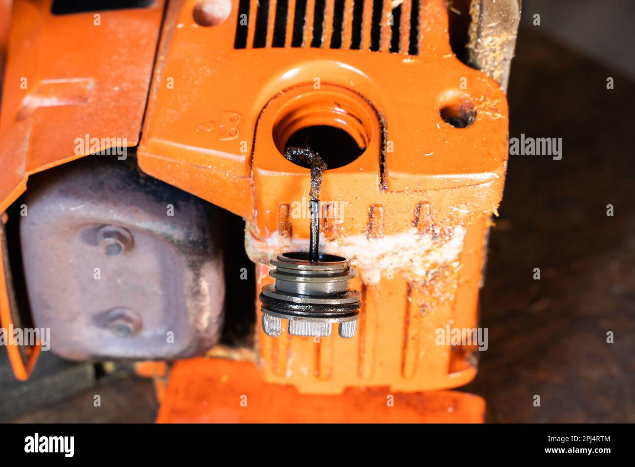 Chainsaw saw chain lubricant symbol. Oil filling container close-up ...