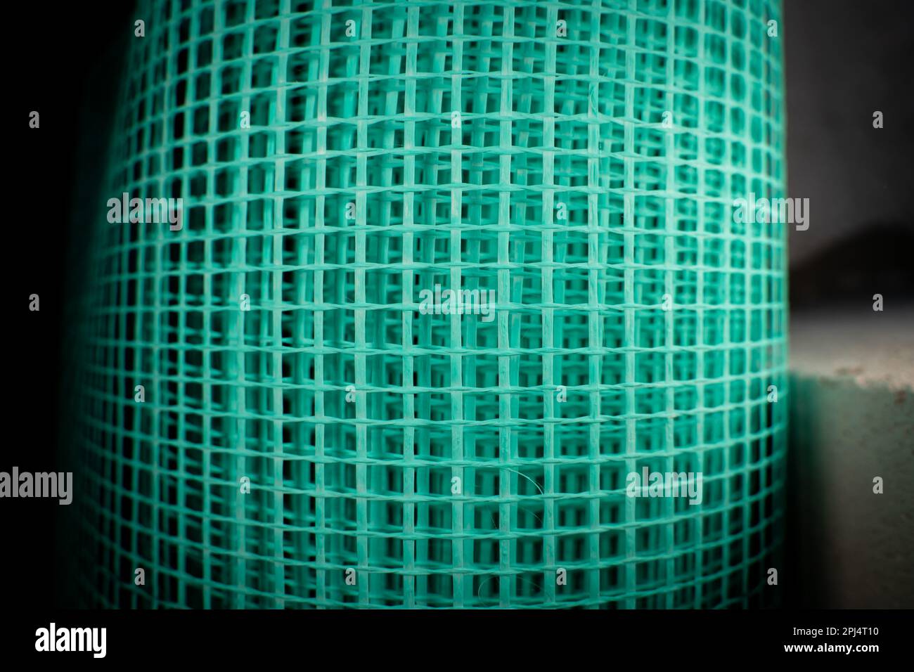 Plastic reinforcing facade mesh in green color close-up. Plaster mesh ...