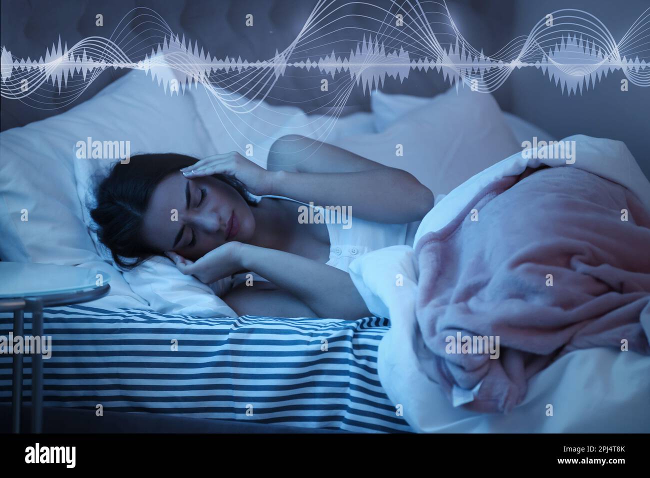 Young woman suffering from insomnia in bed at night. Problem of sleep ...