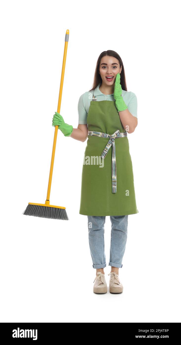 Beautiful young woman with broom on white background Stock Photo - Alamy