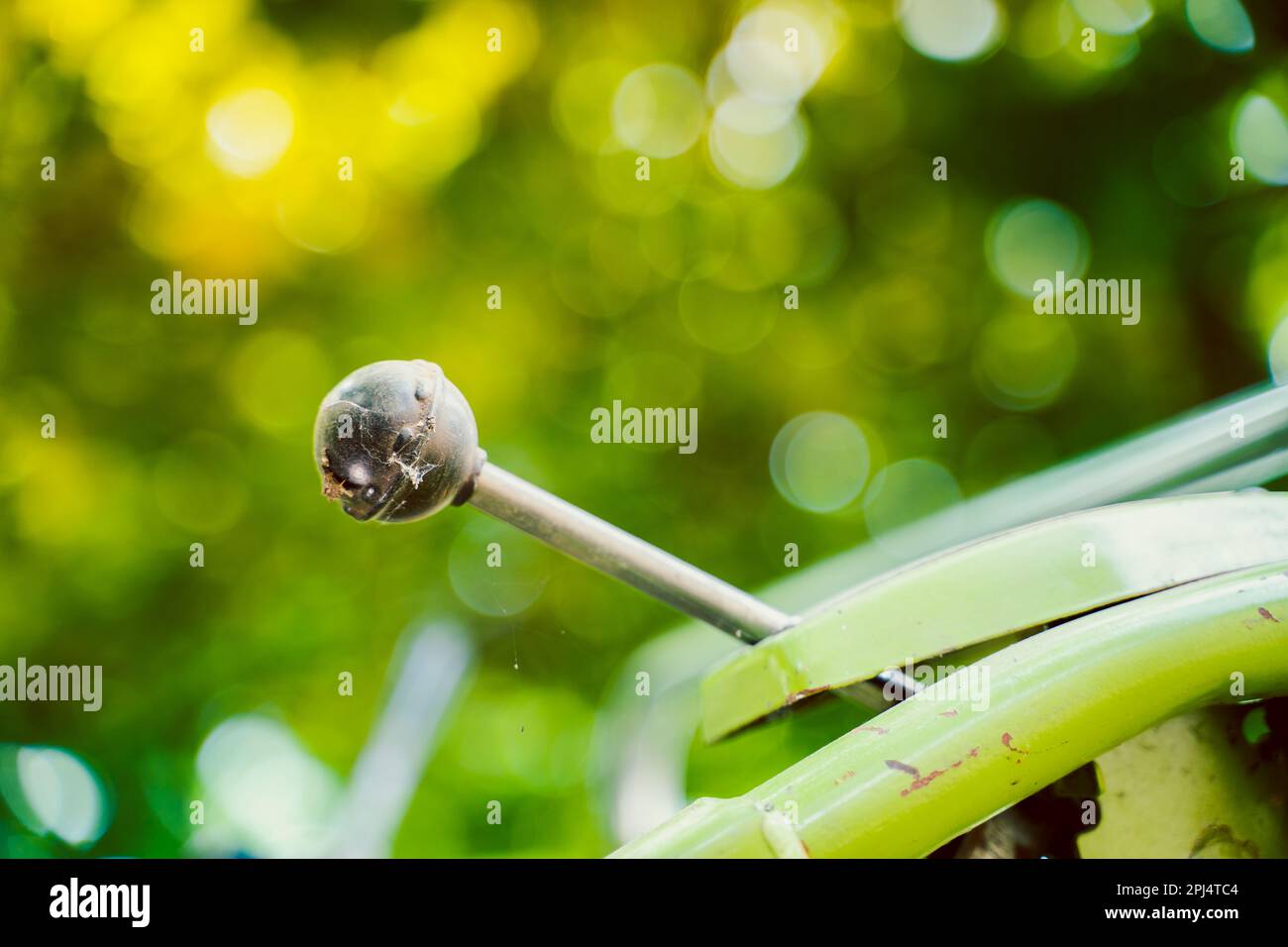 The control lever on a walk-behind tractor close-up on a blurred ...