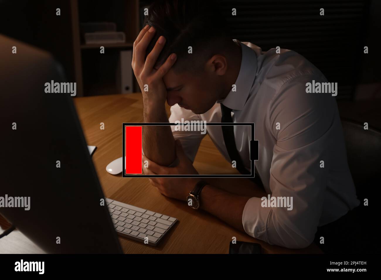 Illustration of discharged battery and tired man at workplace in office ...