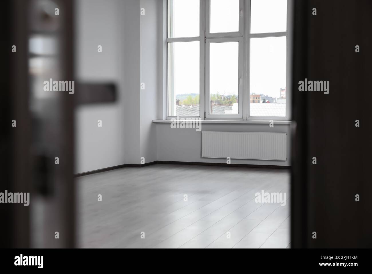 Modern empty office, view through open door Stock Photo - Alamy