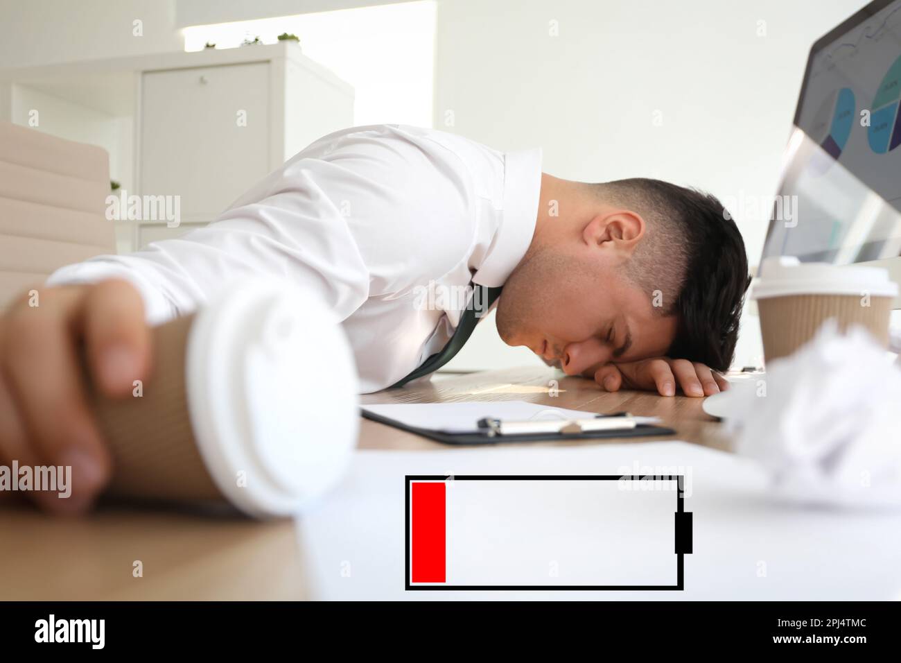 Illustration of discharged battery and tired man at workplace in office ...