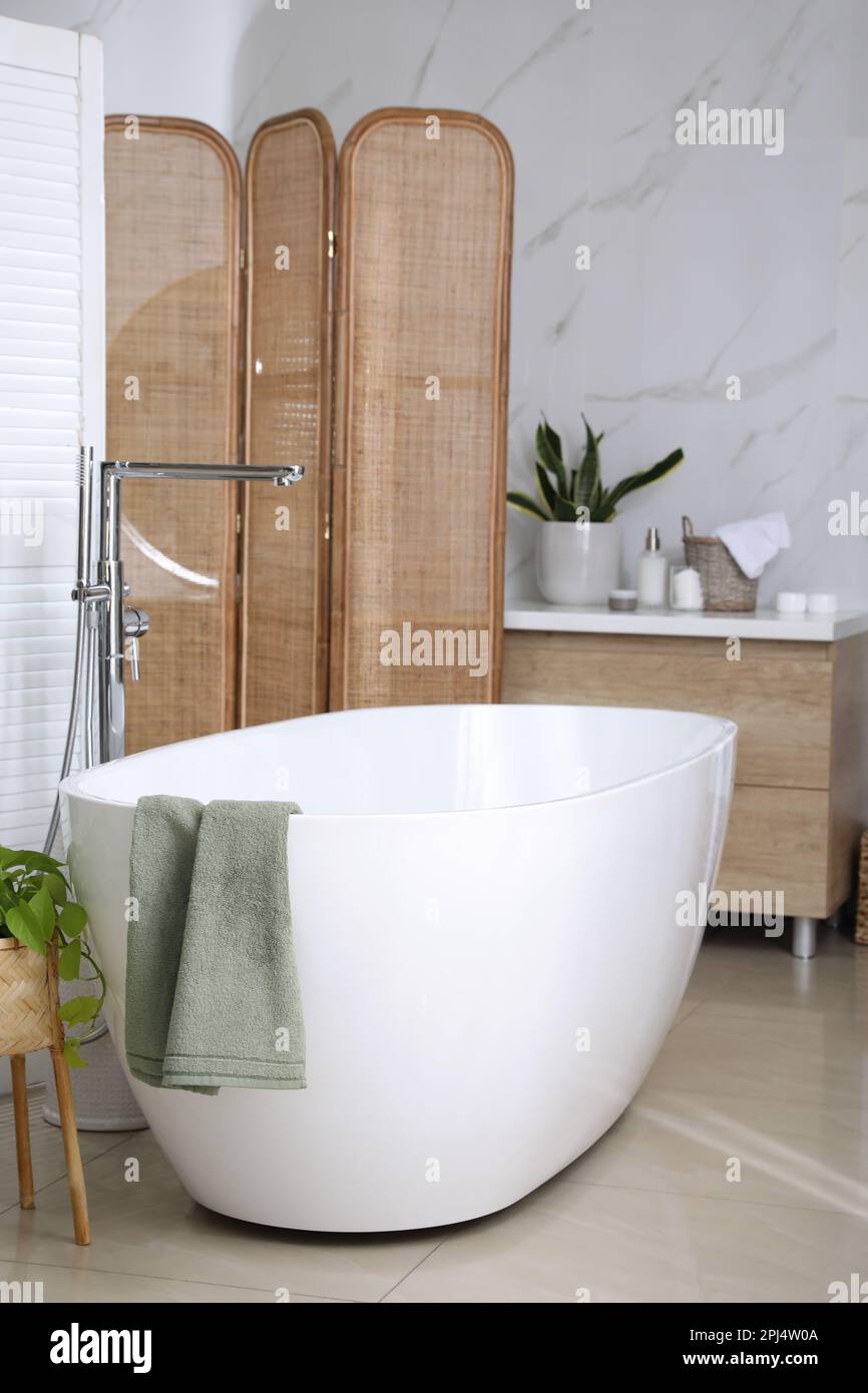 Modern white tub in bathroom. Interior design Stock Photo - Alamy