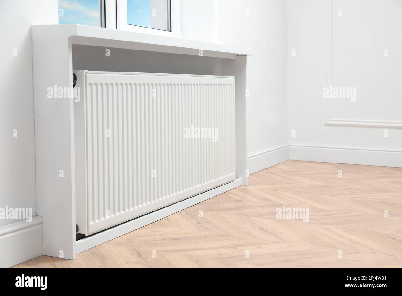 Modern radiator at home, space for text. Central heating system Stock ...