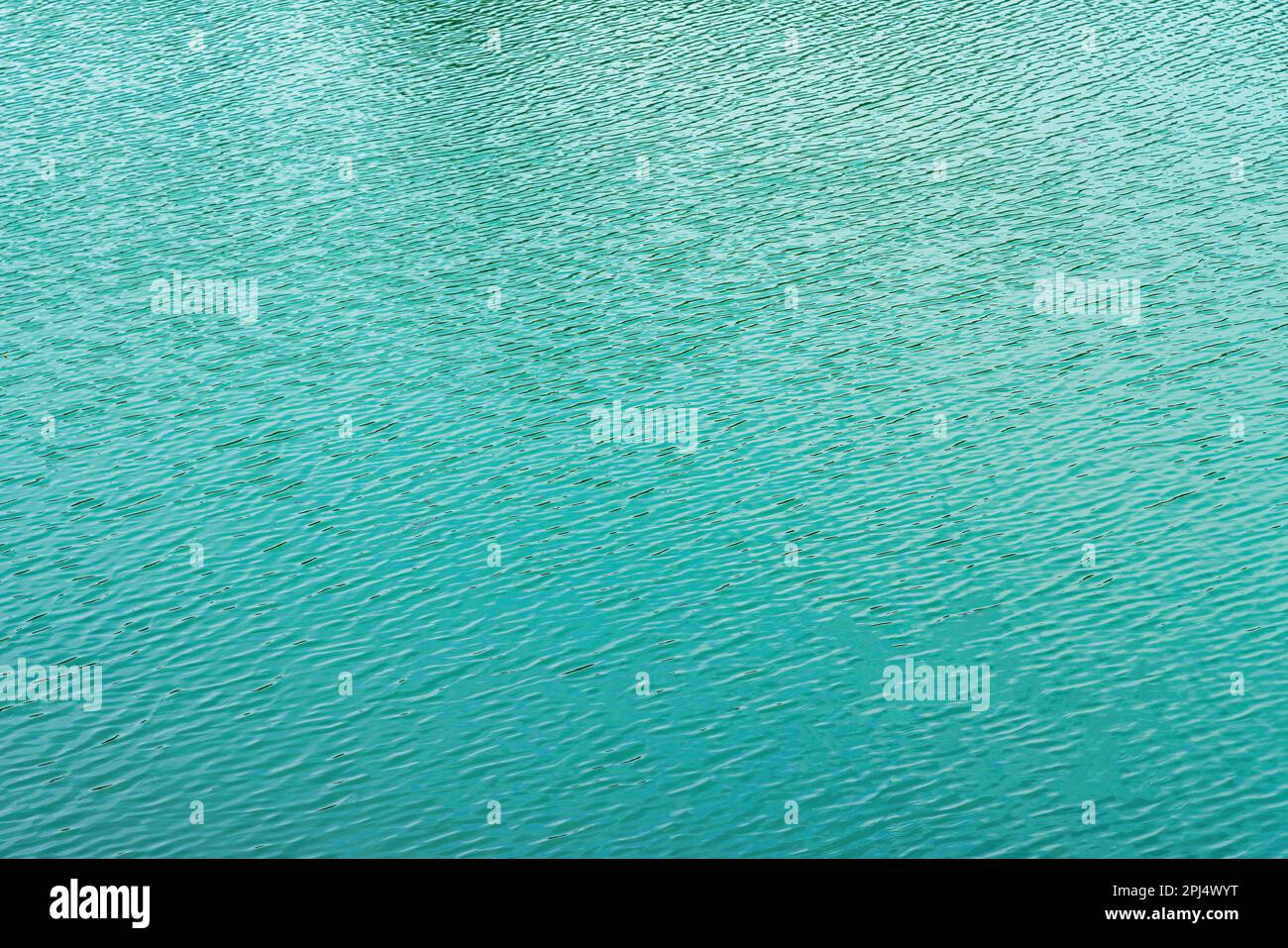 The texture of the waves of turquoise color of fast-flowing water in ...