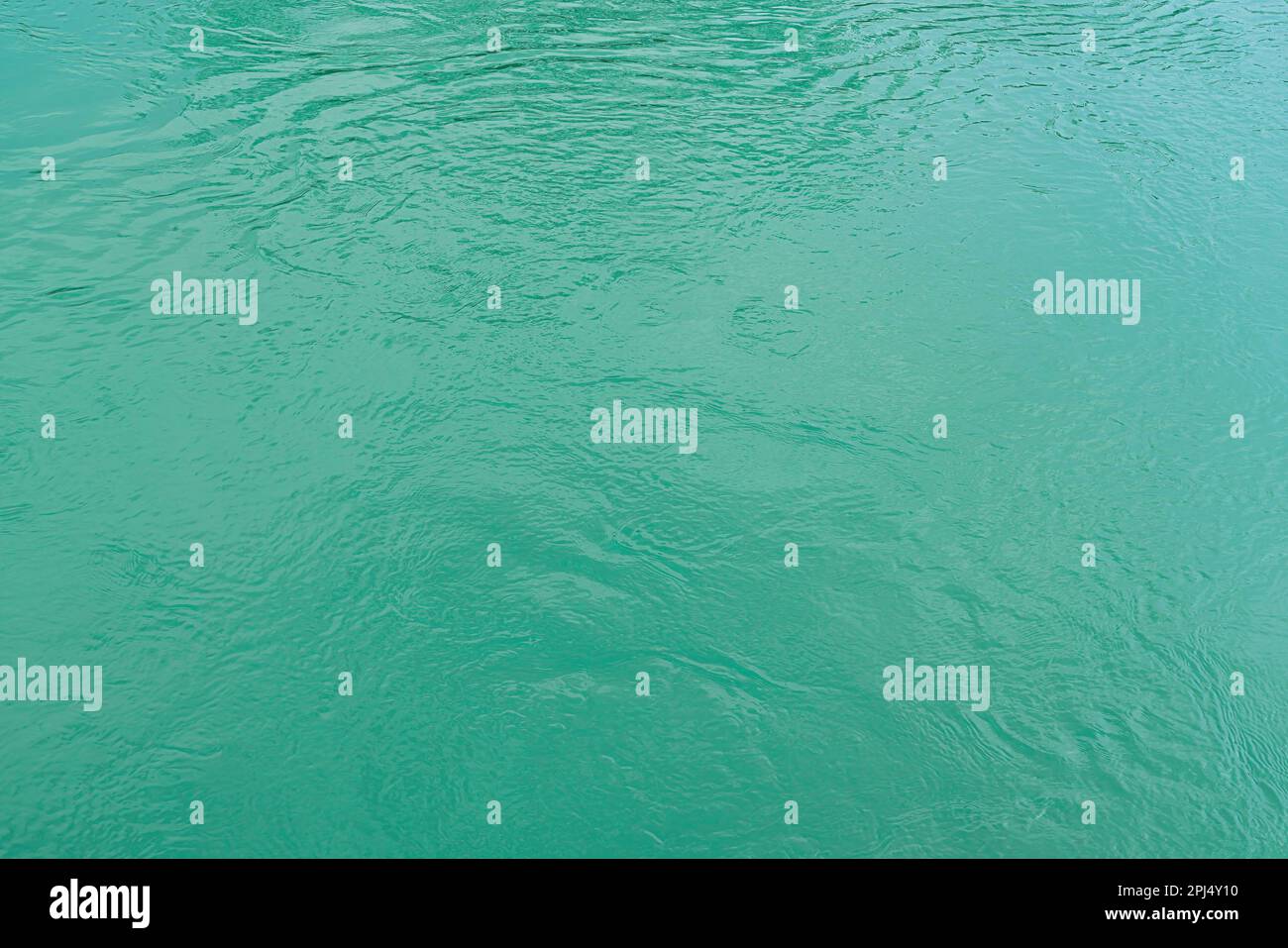 The texture of the waves of turquoise color of fast-flowing water in ...