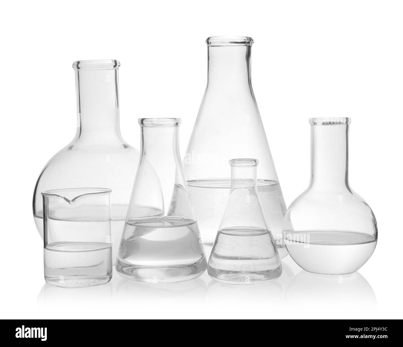Laboratory glassware with transparent liquid on white background Stock ...