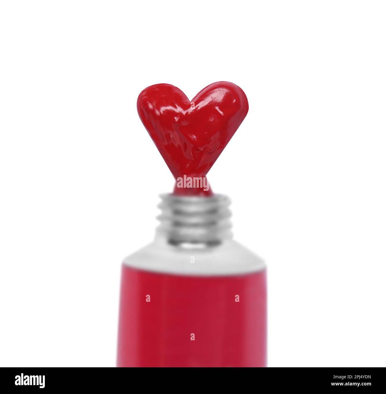Red paint squeezed in shape of heart from tube on white background, top ...