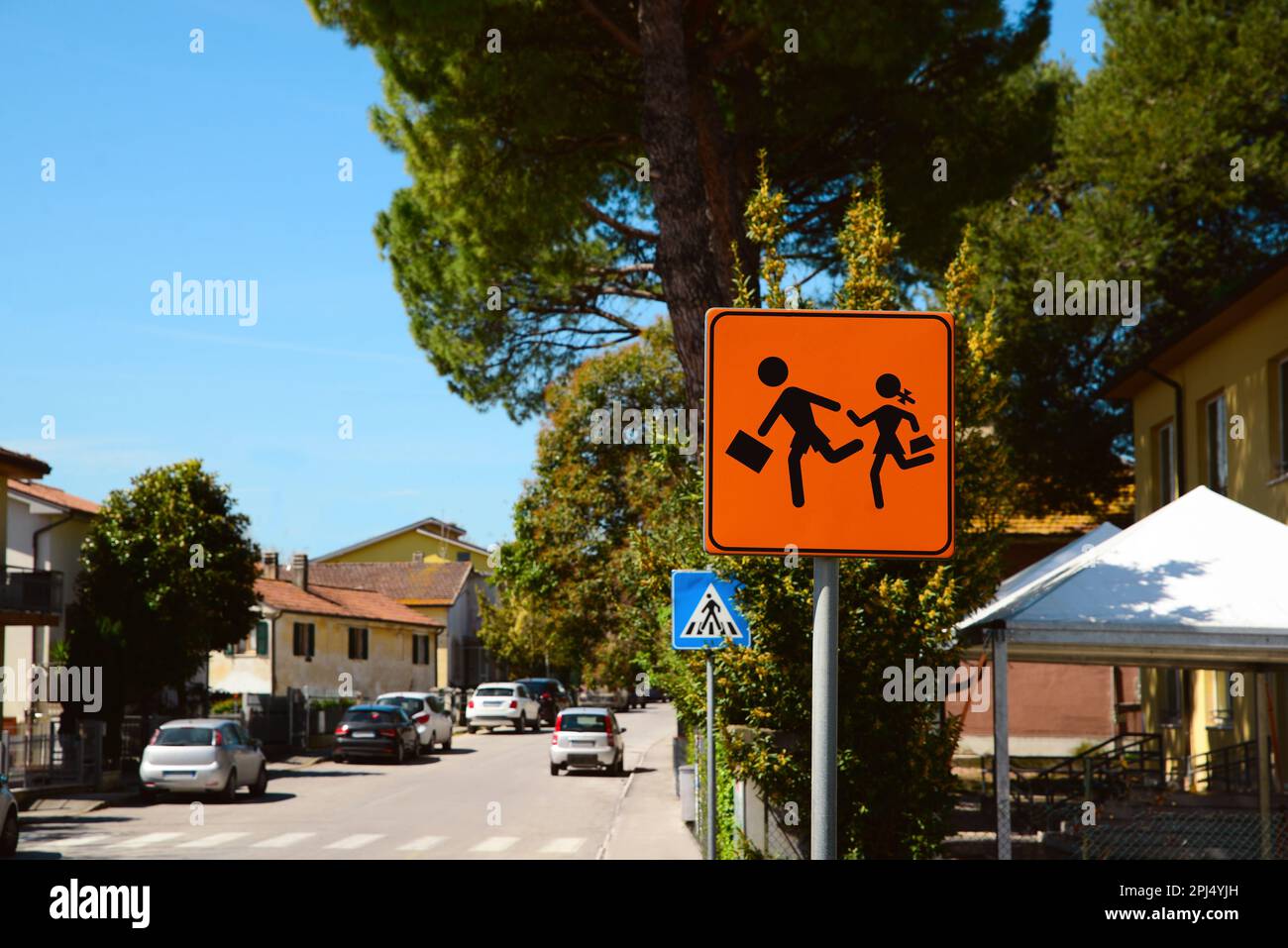 Children Crossing road sign on city street, space for text Stock Photo ...