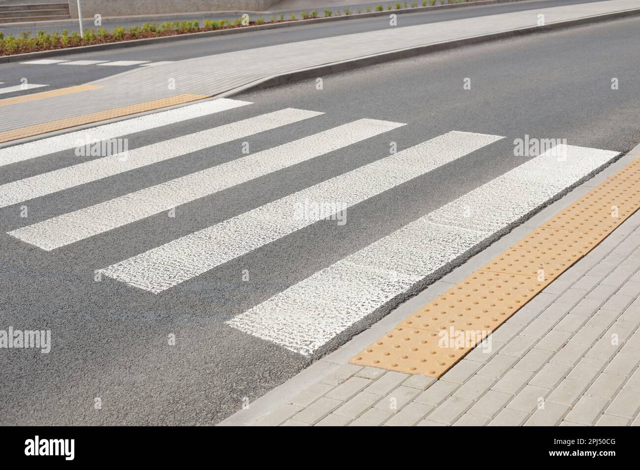 Asphalt road with pedestrian crossing on city street Stock Photo - Alamy