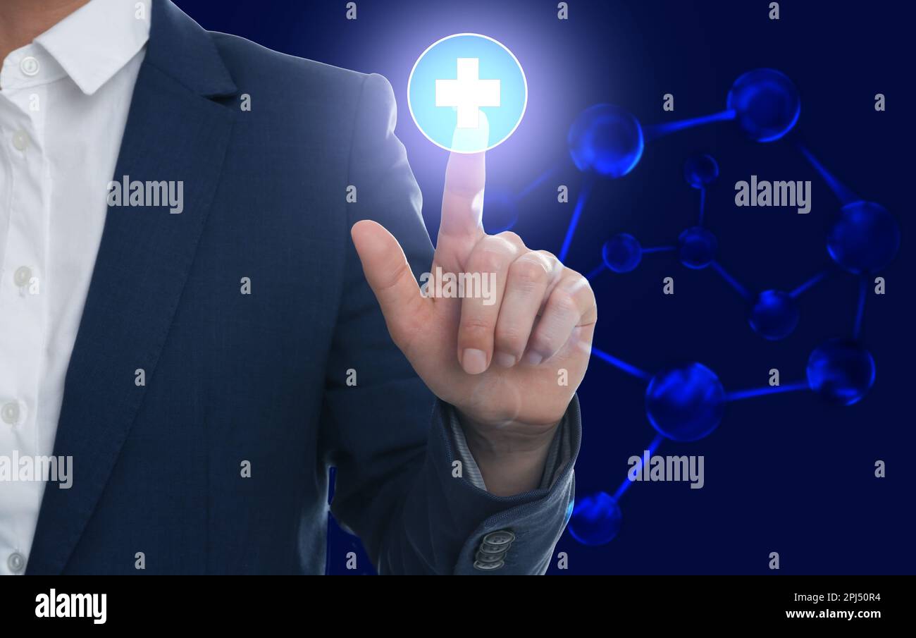 Woman pressing virtual first aid button on blue background, closeup ...