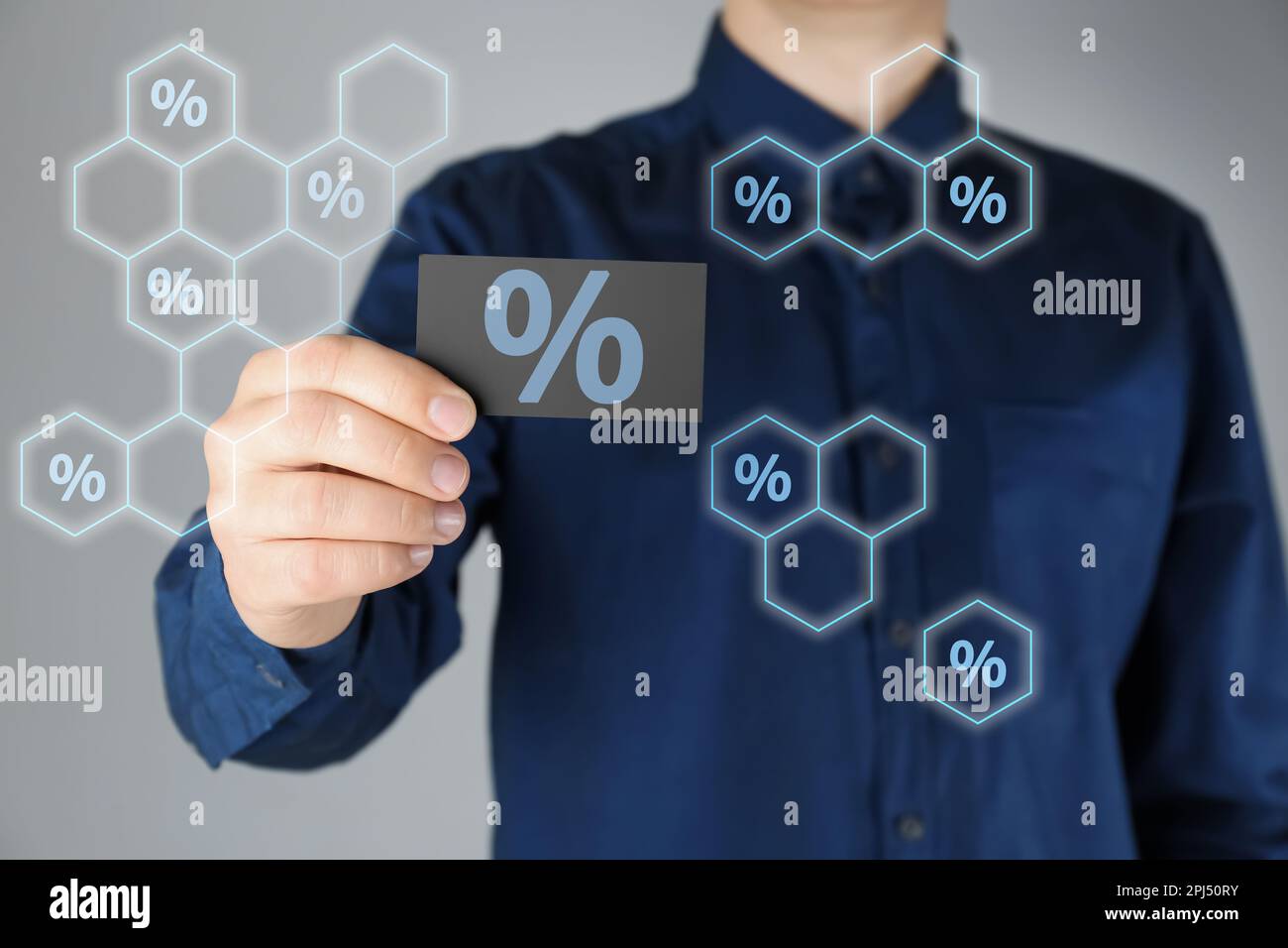 Man showing business card with percent sign on light grey background ...