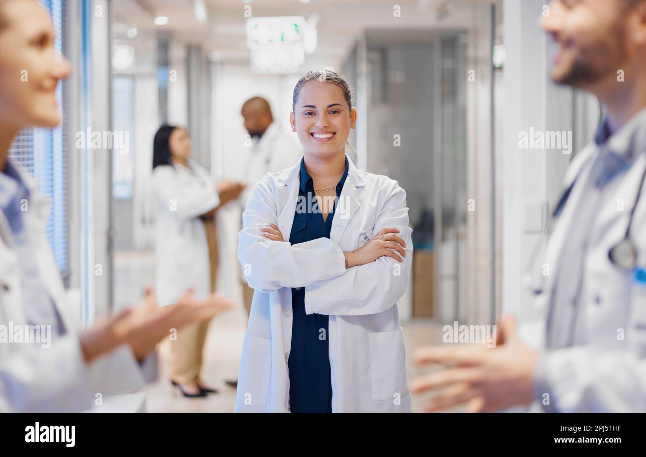 Proud, happy woman doctor with leadership, staff management and hospital workflow or clinic ...