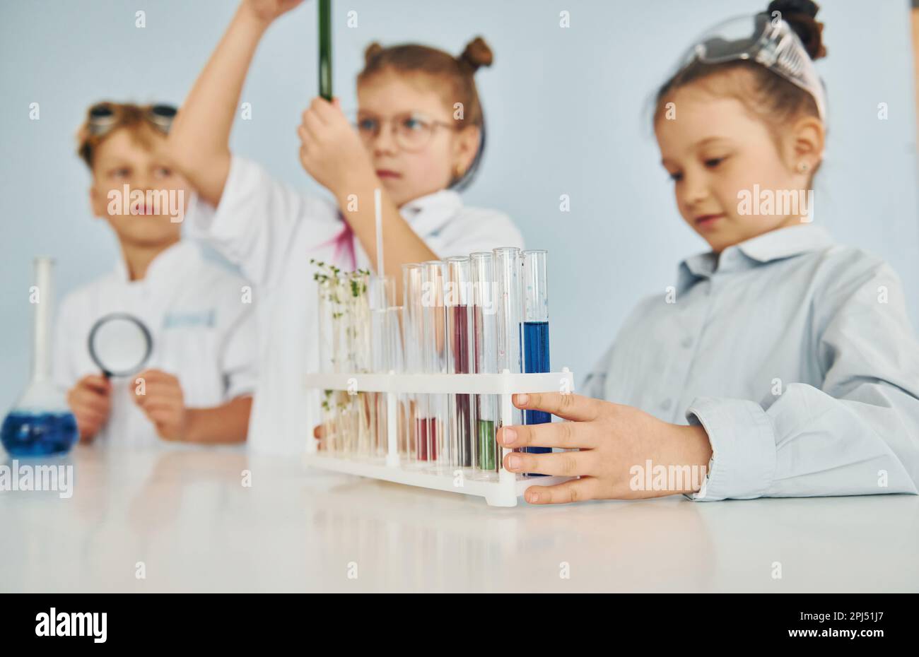 Kids using science lab equipment hi-res stock photography and images ...
