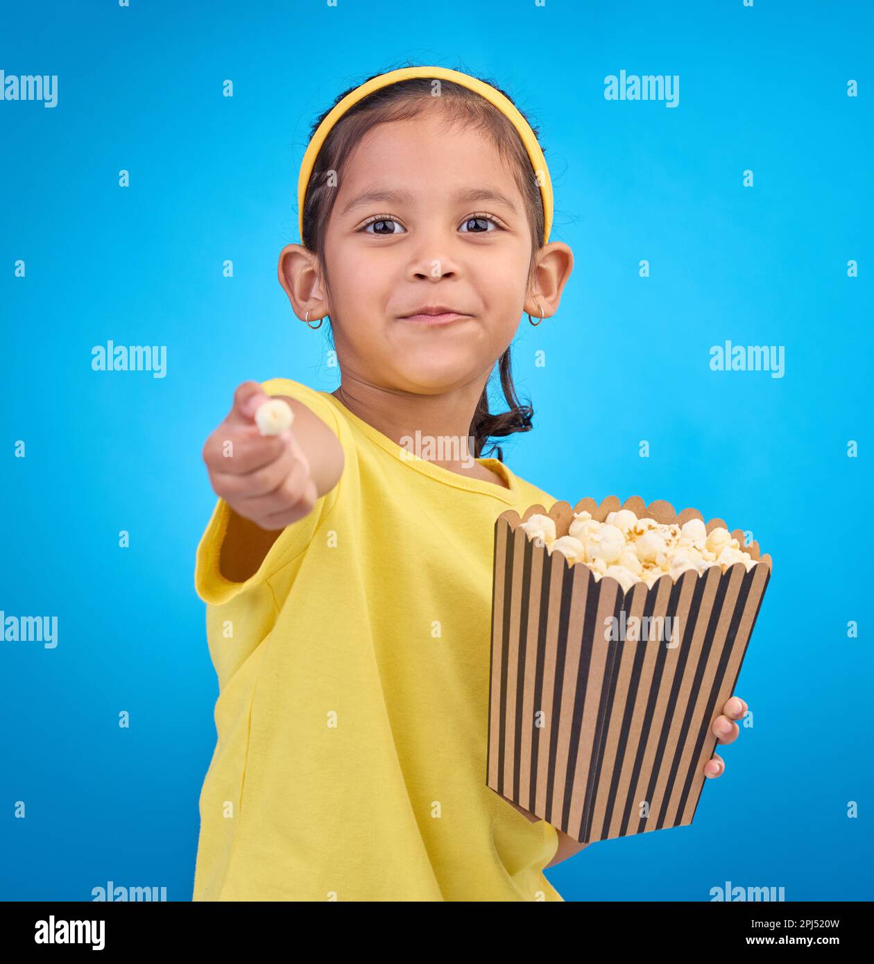 Popcorn, offer and smile with portrait of girl and giving snack to you ...