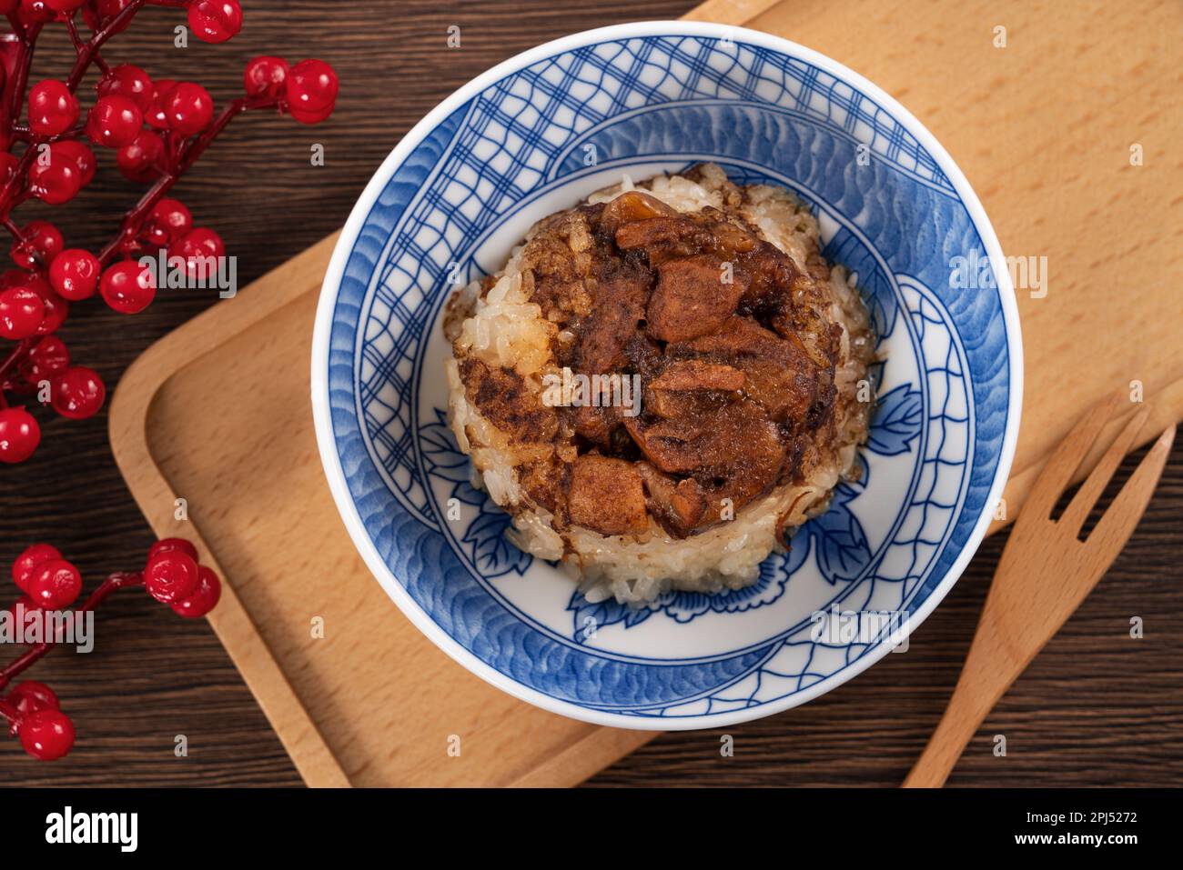 Migao, tube rice cake, rice pudding in a bowl topped with minced pork ...