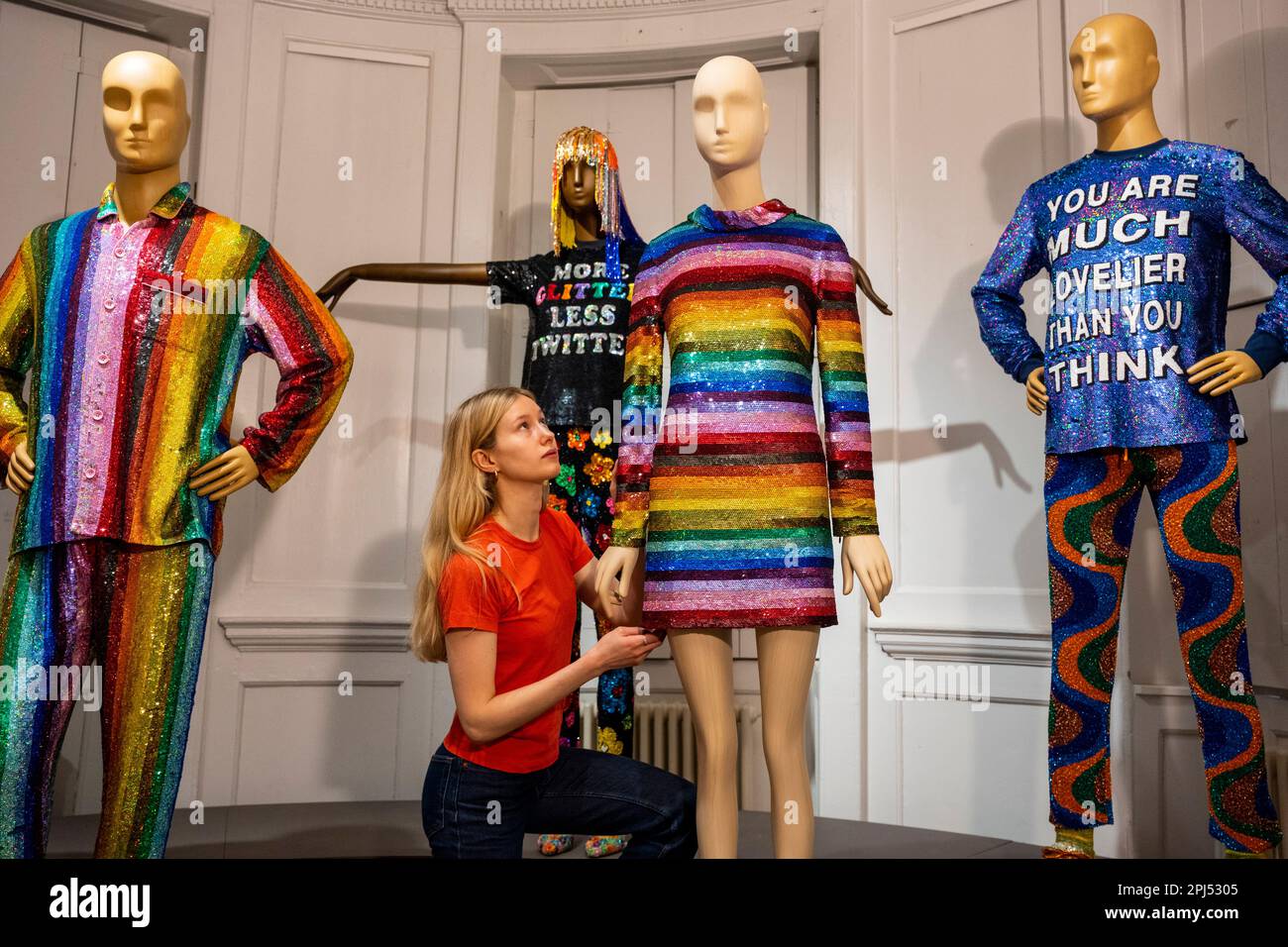 London, UK. 31 March 2023. A staff member with 'Rainbow dress', AW2017 ...