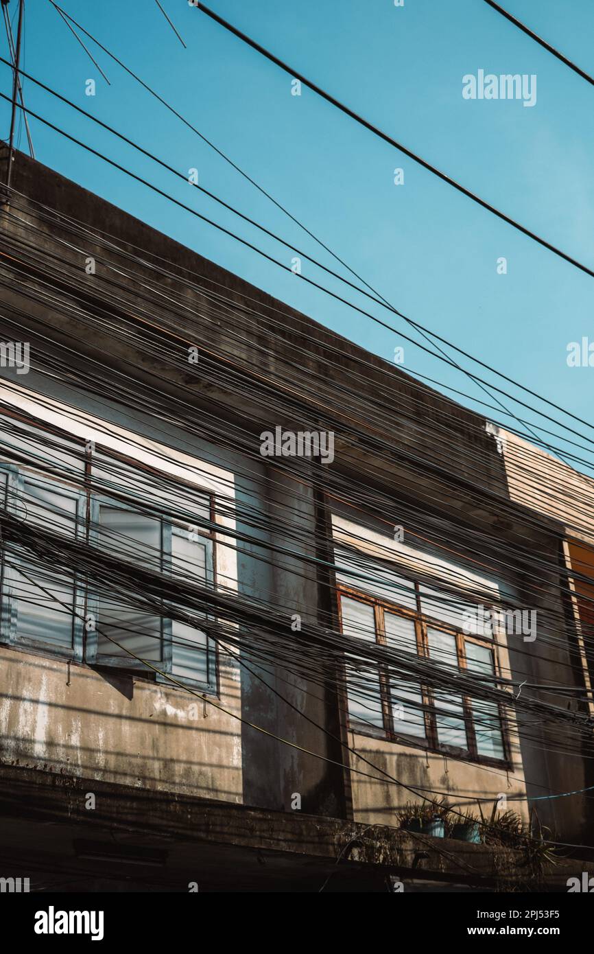 A close up view of a vintage roof, with multiple electrical cables ...